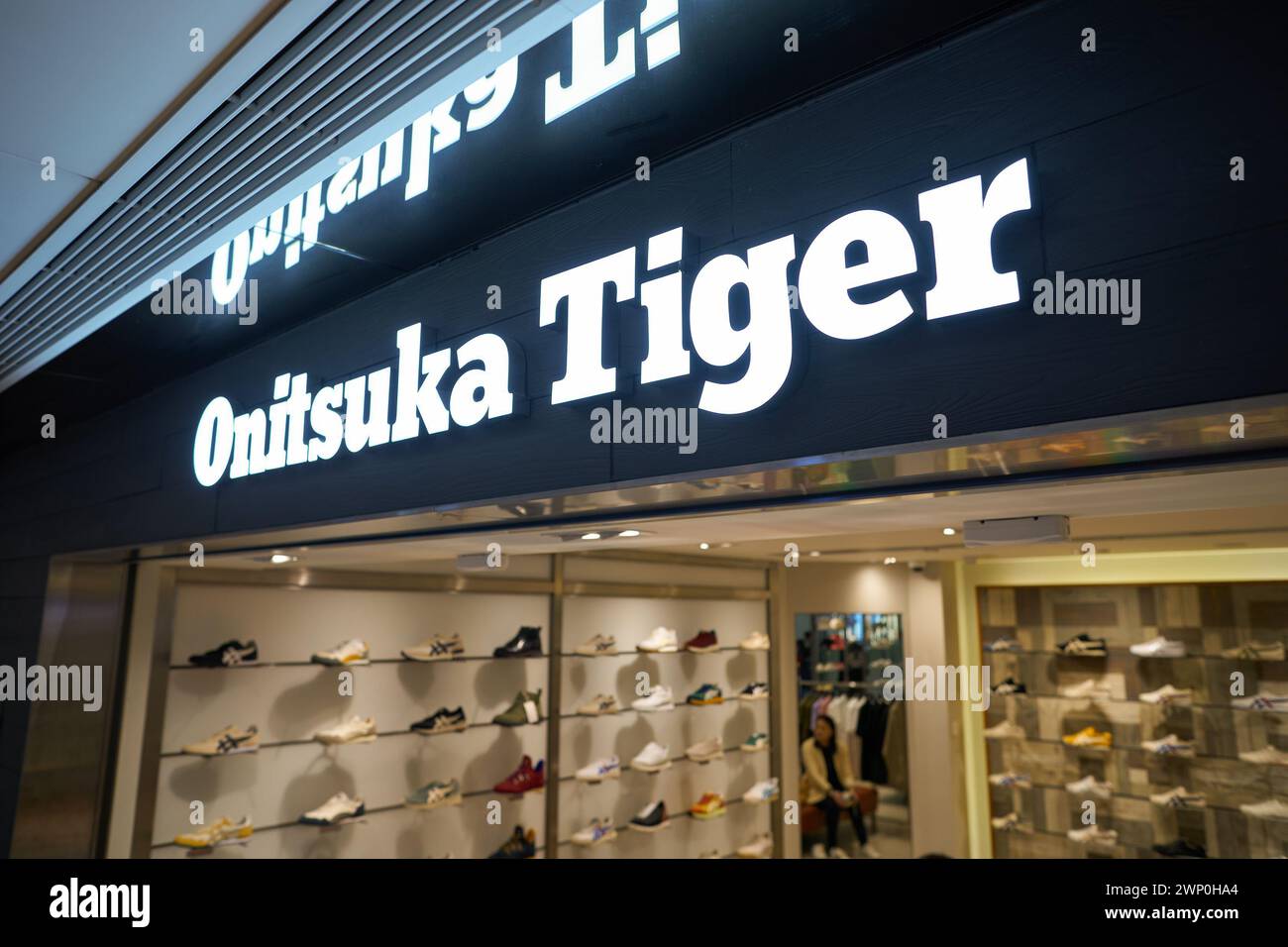 HONG KONG, CHINA - DECEMBER 04, 2023: Onitsuka Tiger sign as seen at a ...