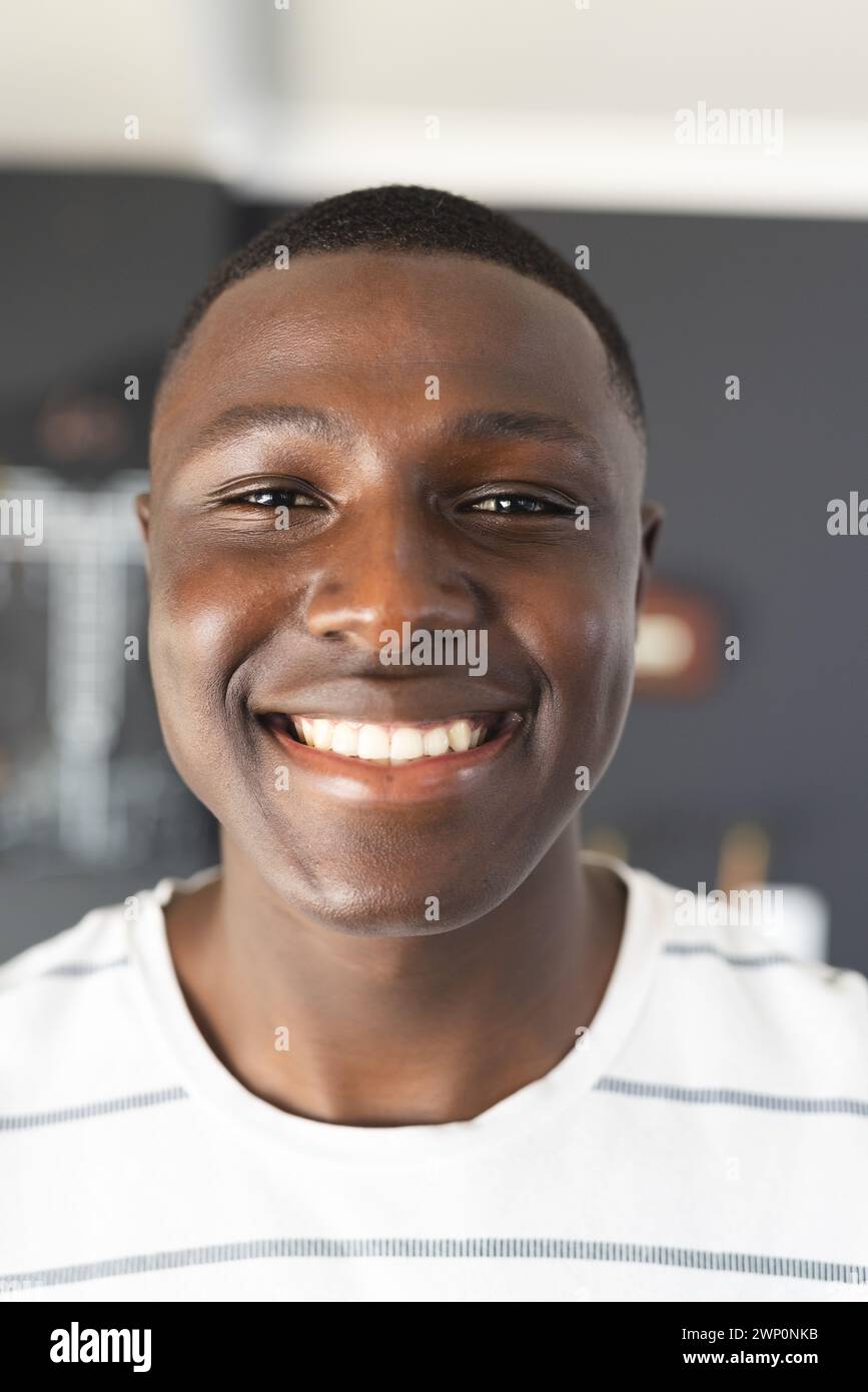 Beaming handsome young man hi-res stock photography and images - Alamy