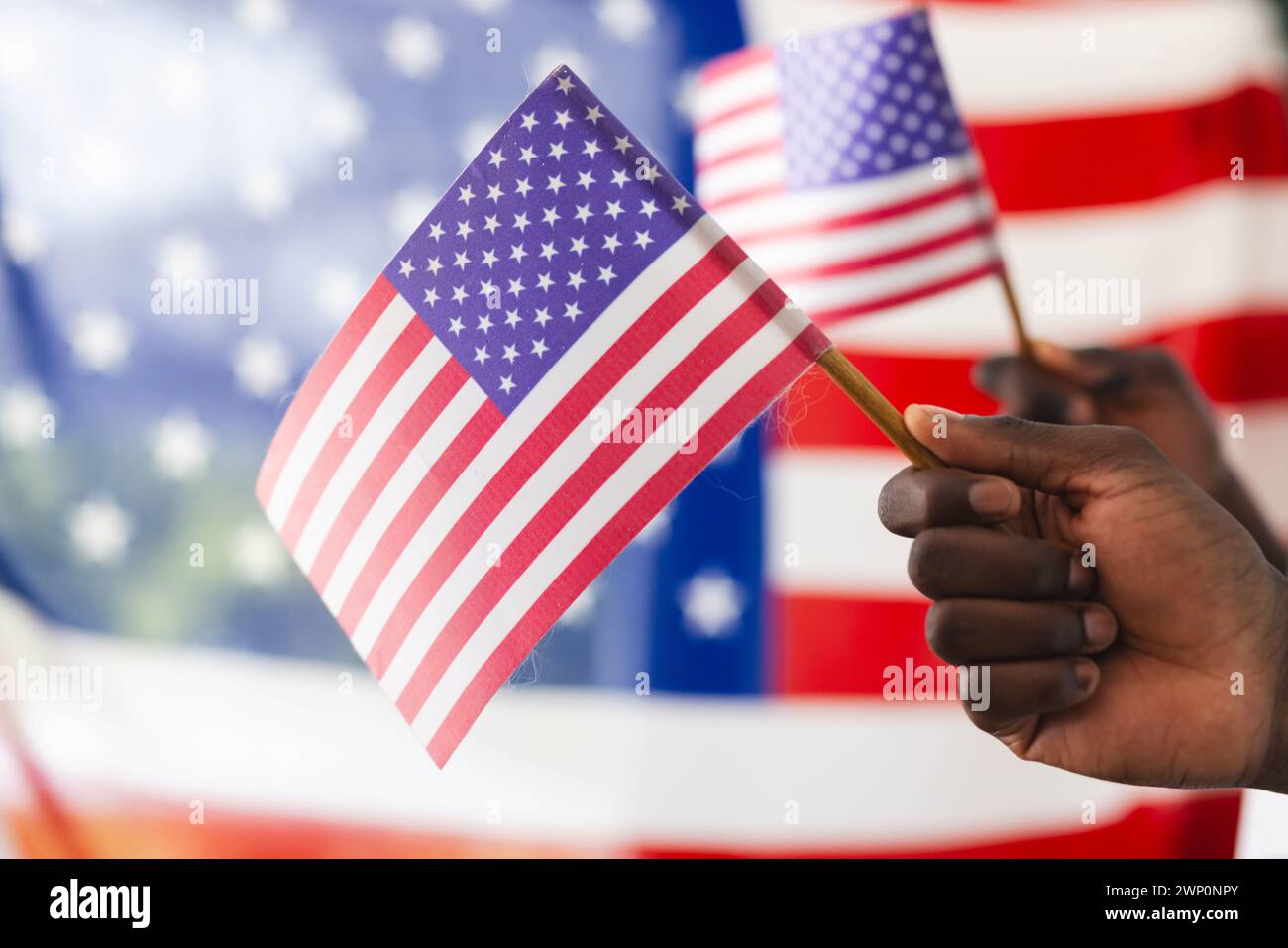 Hand holding flag hi-res stock photography and images - Alamy