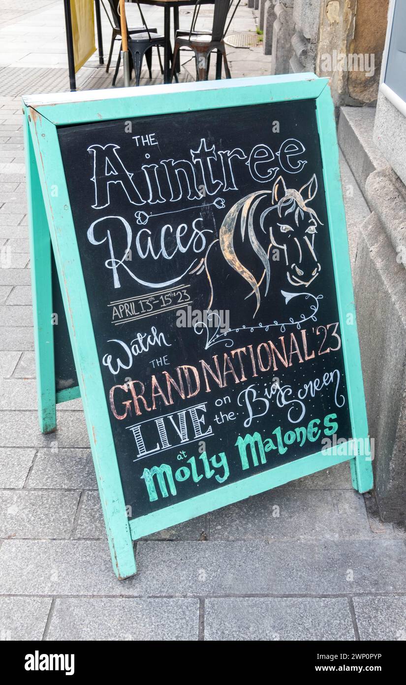 Irish bar folding sign announcing Aintree Races Stock Photo - Alamy