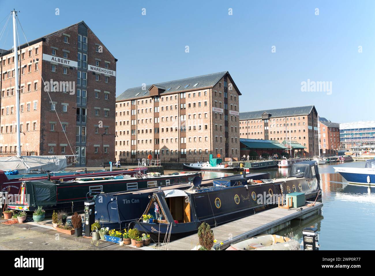 UK, Gloucester, docks and wharf warehouse buildings, with canal boats ...
