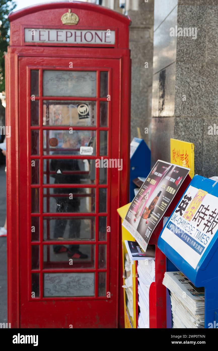 UK, London, traditional red telephone boxes in China town with Chinese ...