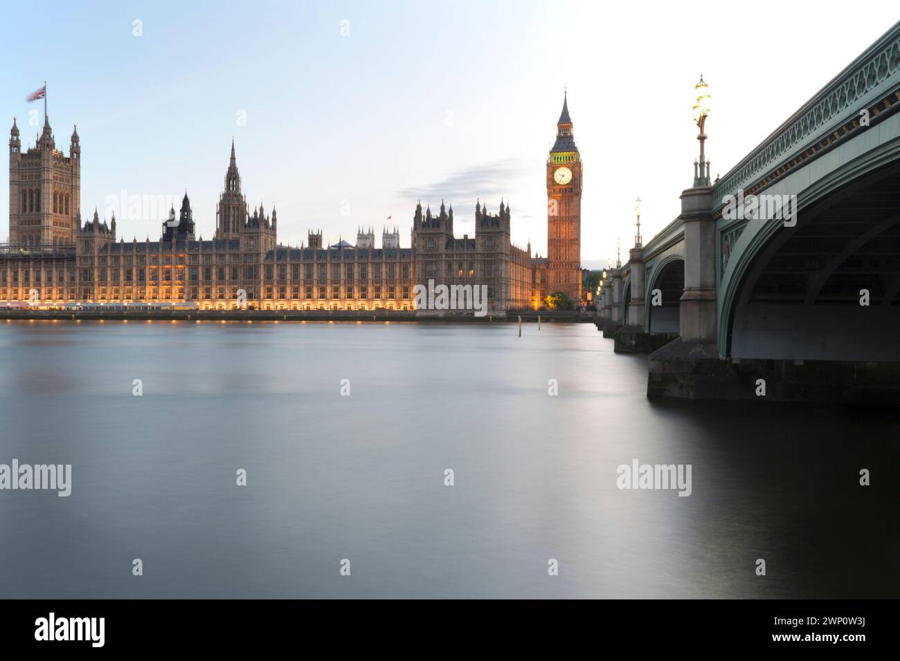 UK, London, Parliament building, the river Thames and Westminster bridge reflections at dusk ...