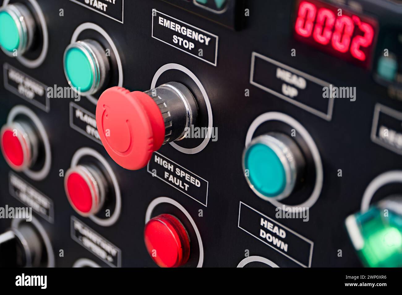 Black control panel with red and green round lamps and buttons ...