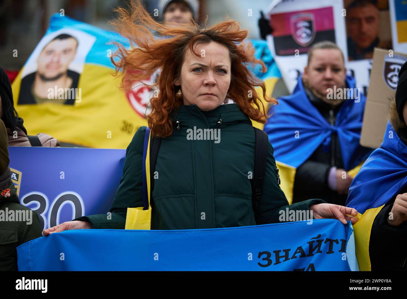 Sad Ukrainian woman holding a flag on the public demonstration ...