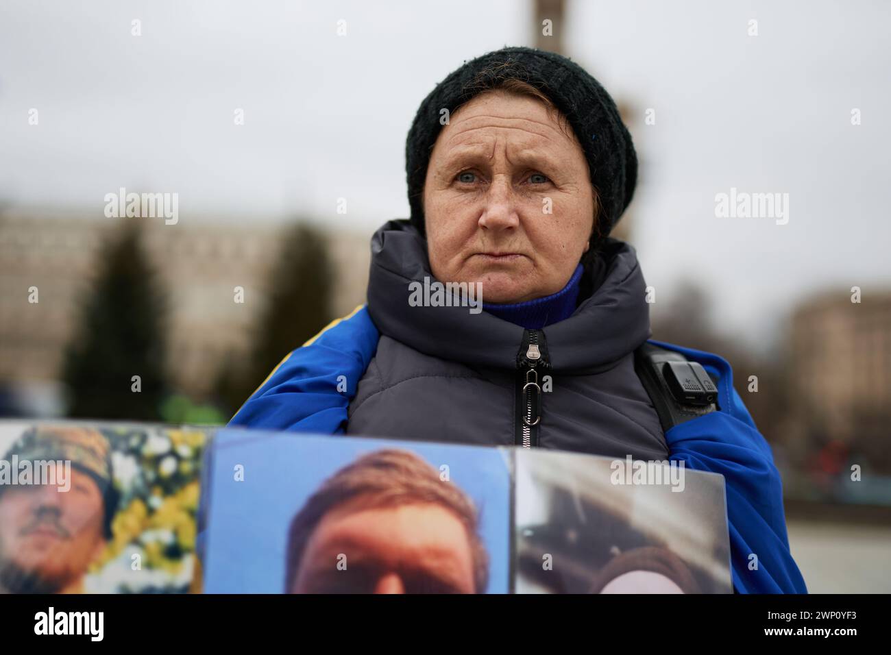 Portrait of a sad Ukrainian senior woman on a peaceful demonstration ...