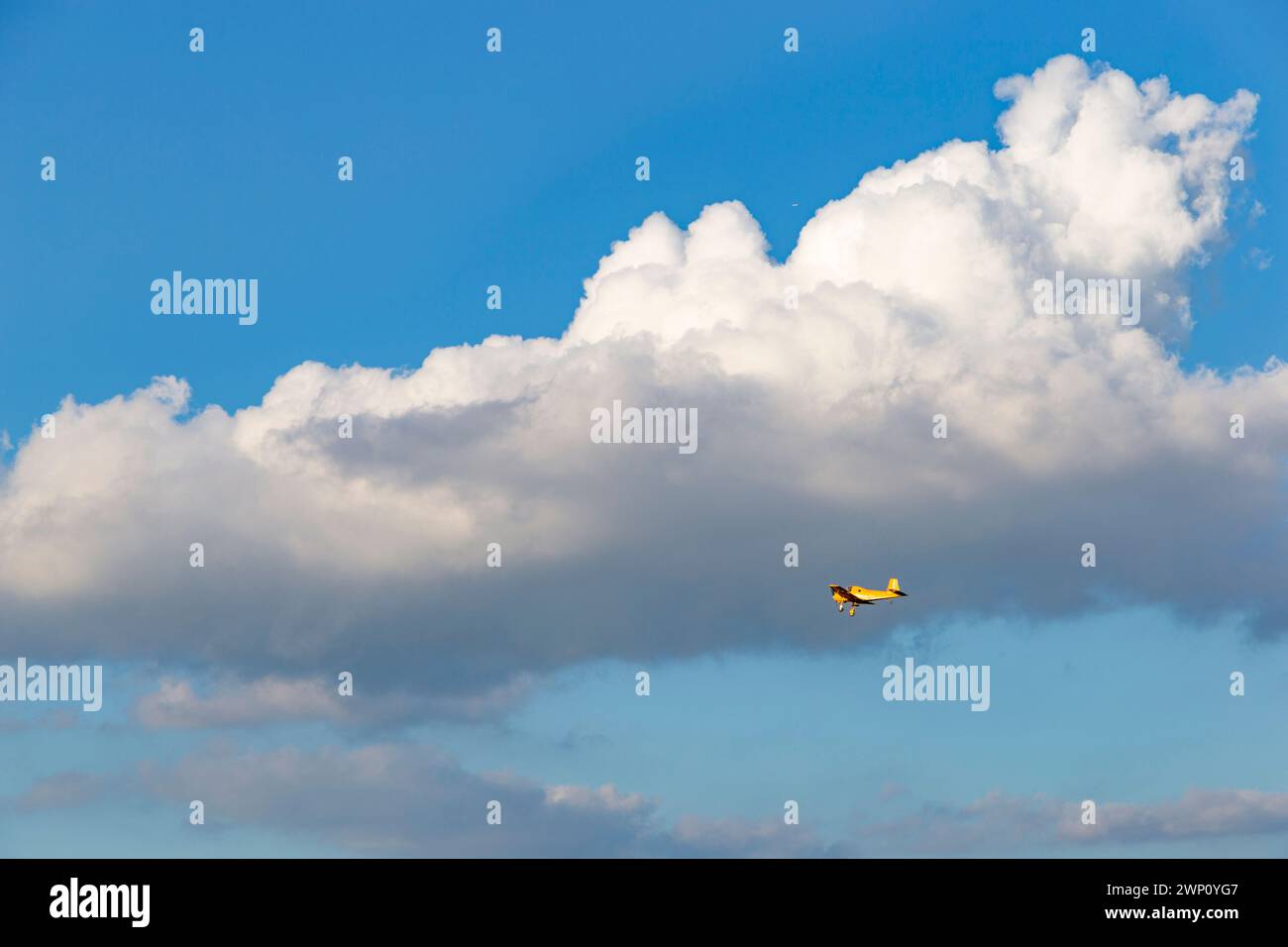 A spray plane in blue sky. Agricultural aviation Stock Photo - Alamy