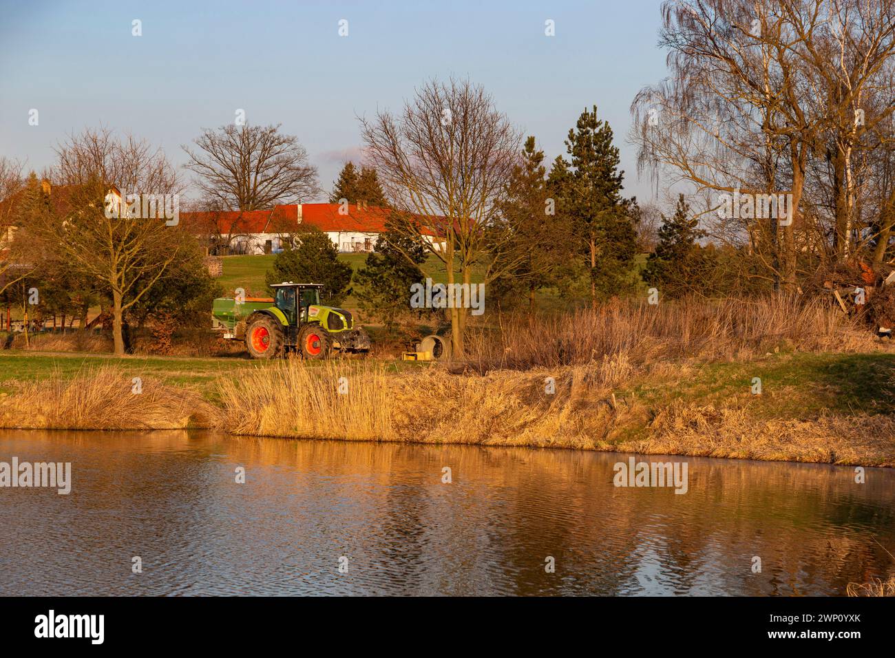 Tractor with plough on stubble field hi-res stock photography and ...
