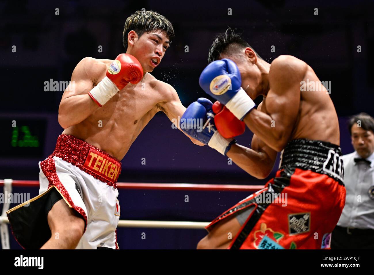 Subaru Murata (red gloves) of Japan and Alex Santisima Jr. (blue gloves) of the Philippines ...