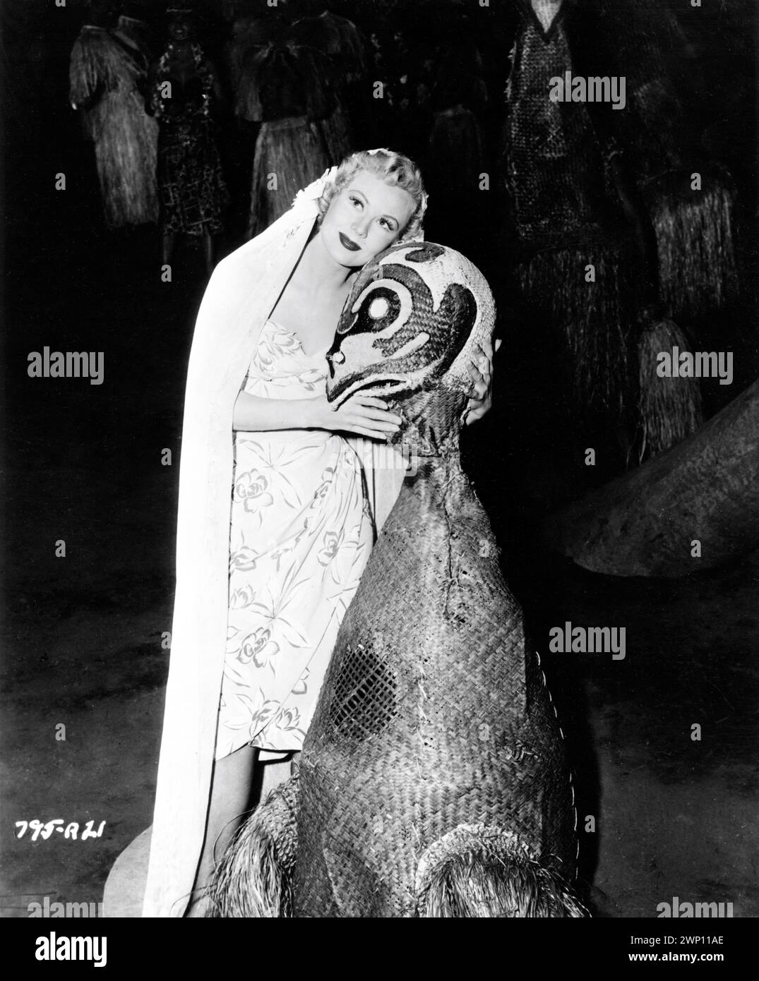 VIRGINIA MAYO on set candid pose with bird figure / statue in SOUTH SEA ...