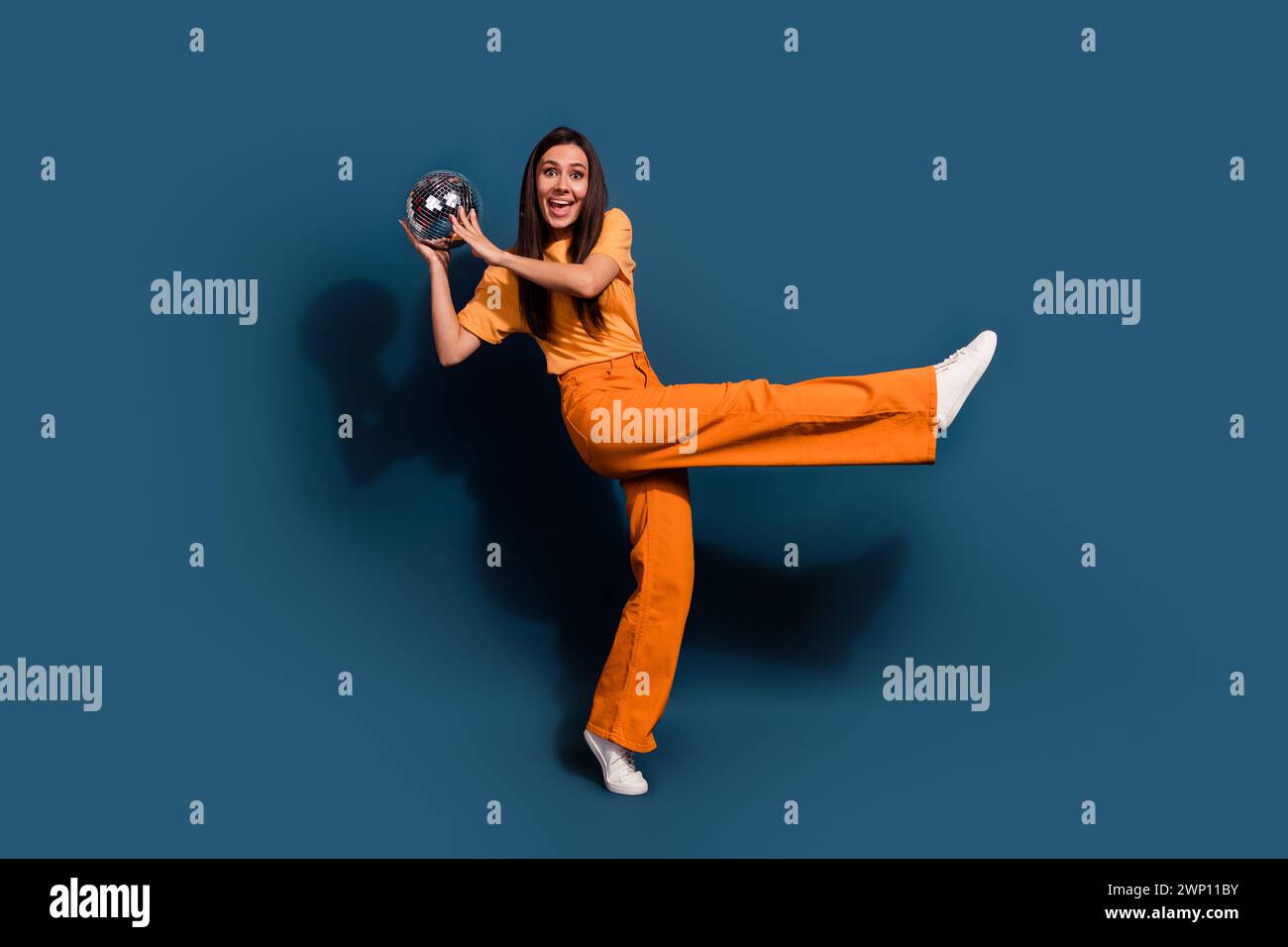 Full body length photo of crazy girl wear orange look seems happy with ...