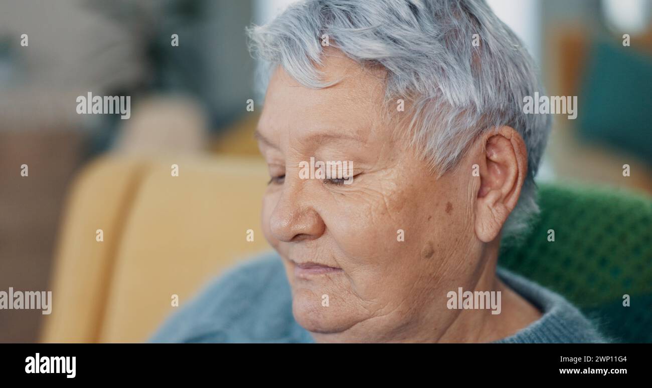 Face, memory or nostalgia with senior woman on sofa of living room in home to relax for ...