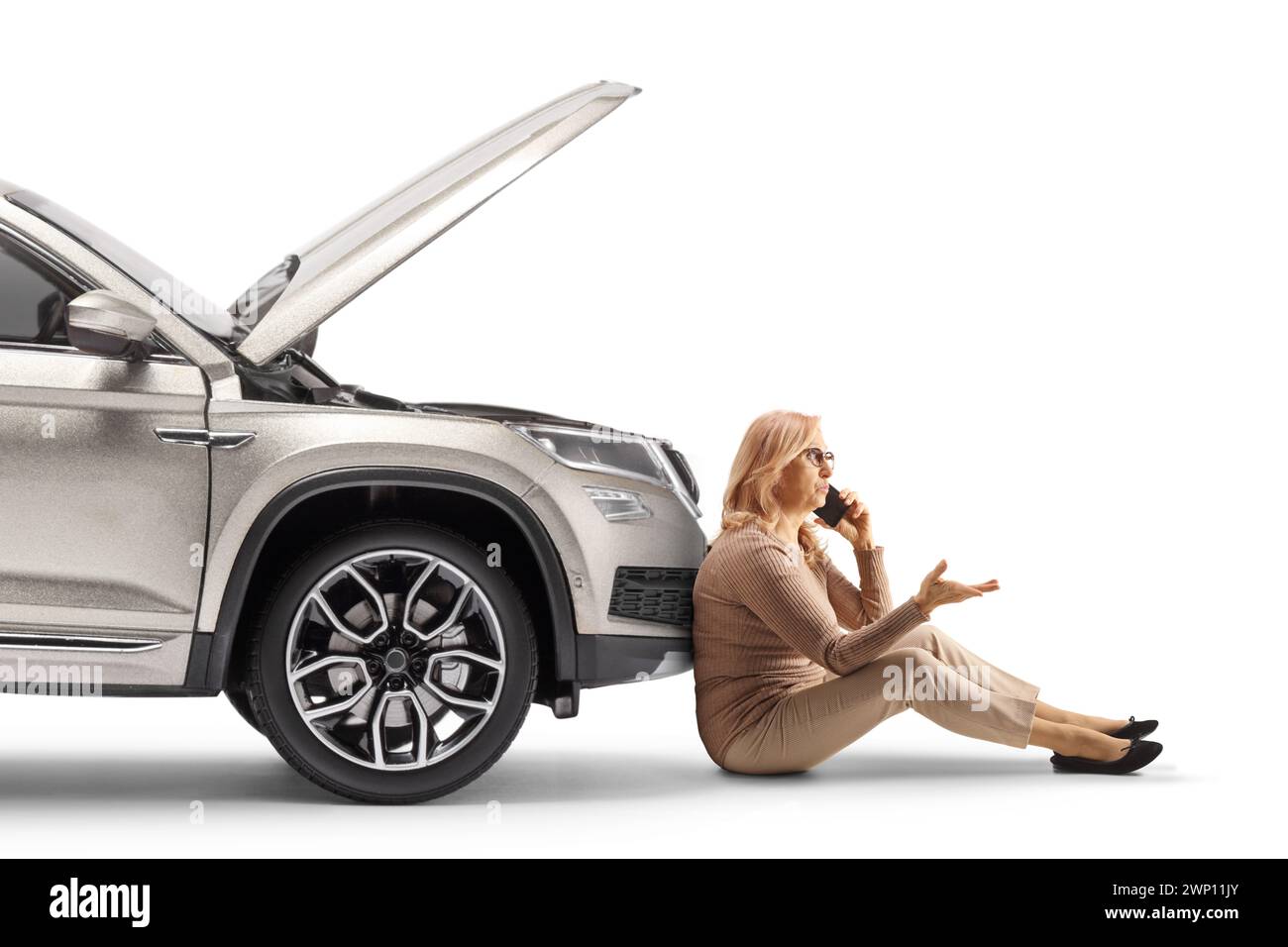 Angry woman driver with a car problem calling a repair company isolated ...