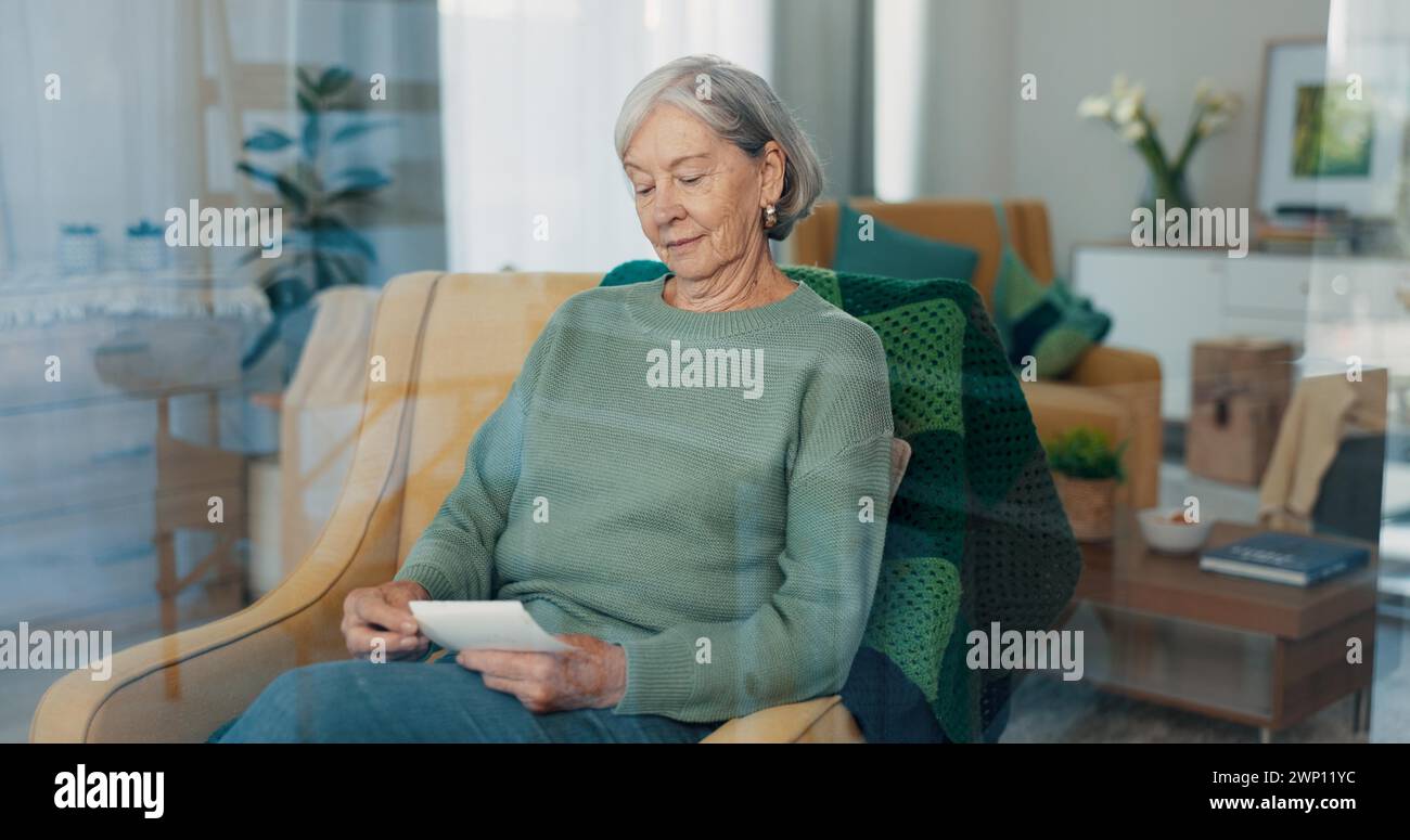 Elderly woman, photograph and retirement in nursing home with memory, relax with history for ...