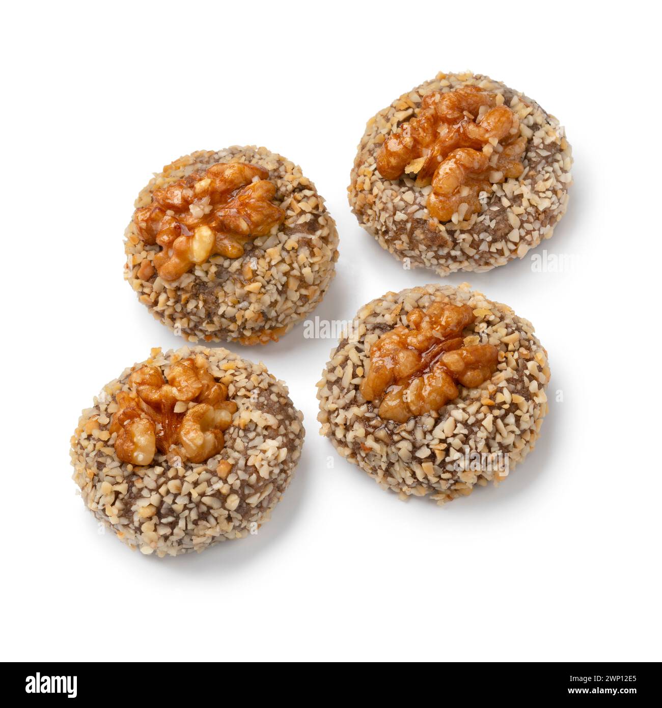Traditional fresh baked Moroccan Ghoriba cookies topped with a walnut ...