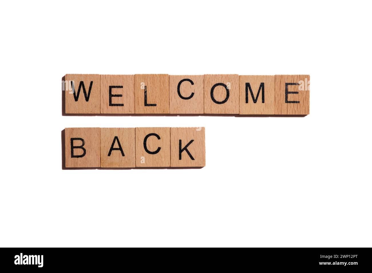 Welcome back sign on white background Stock Photo - Alamy
