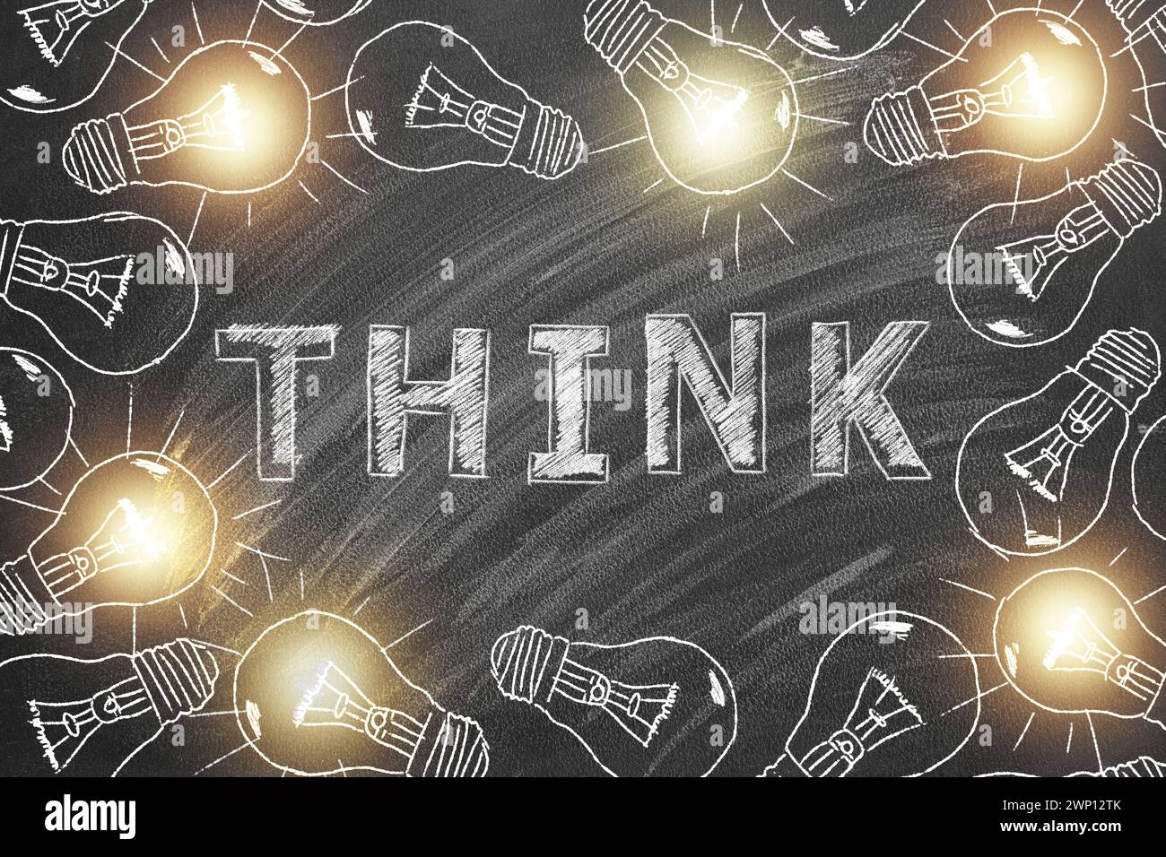 Shining light bulbs with lettering THINK hand drawn in chalk on ...