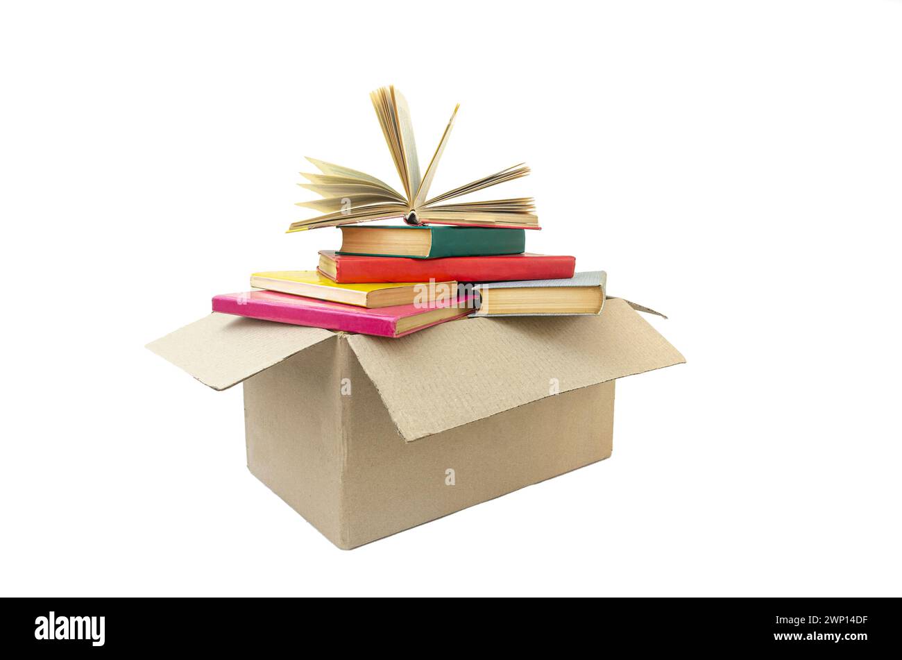 Moving house cardboard box filled with books, isolated on white ...