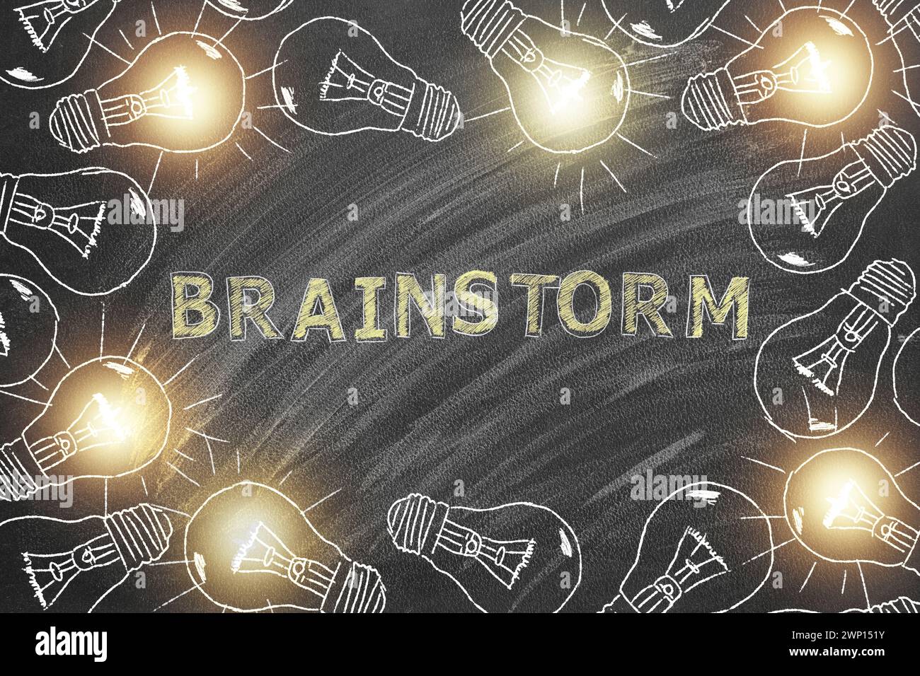 Shining light bulbs with lettering BRAINSTORM hand drawn in chalk on ...