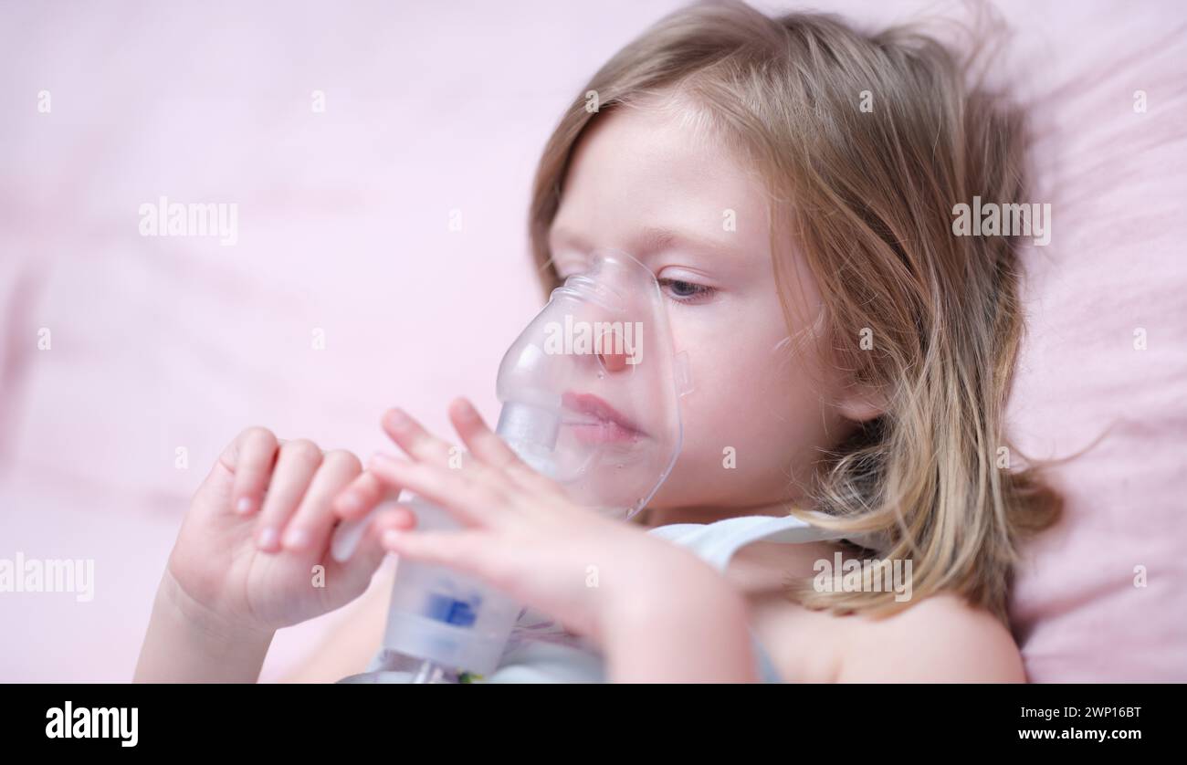 Portrait of child girl with inhaler for asthma Stock Photo - Alamy