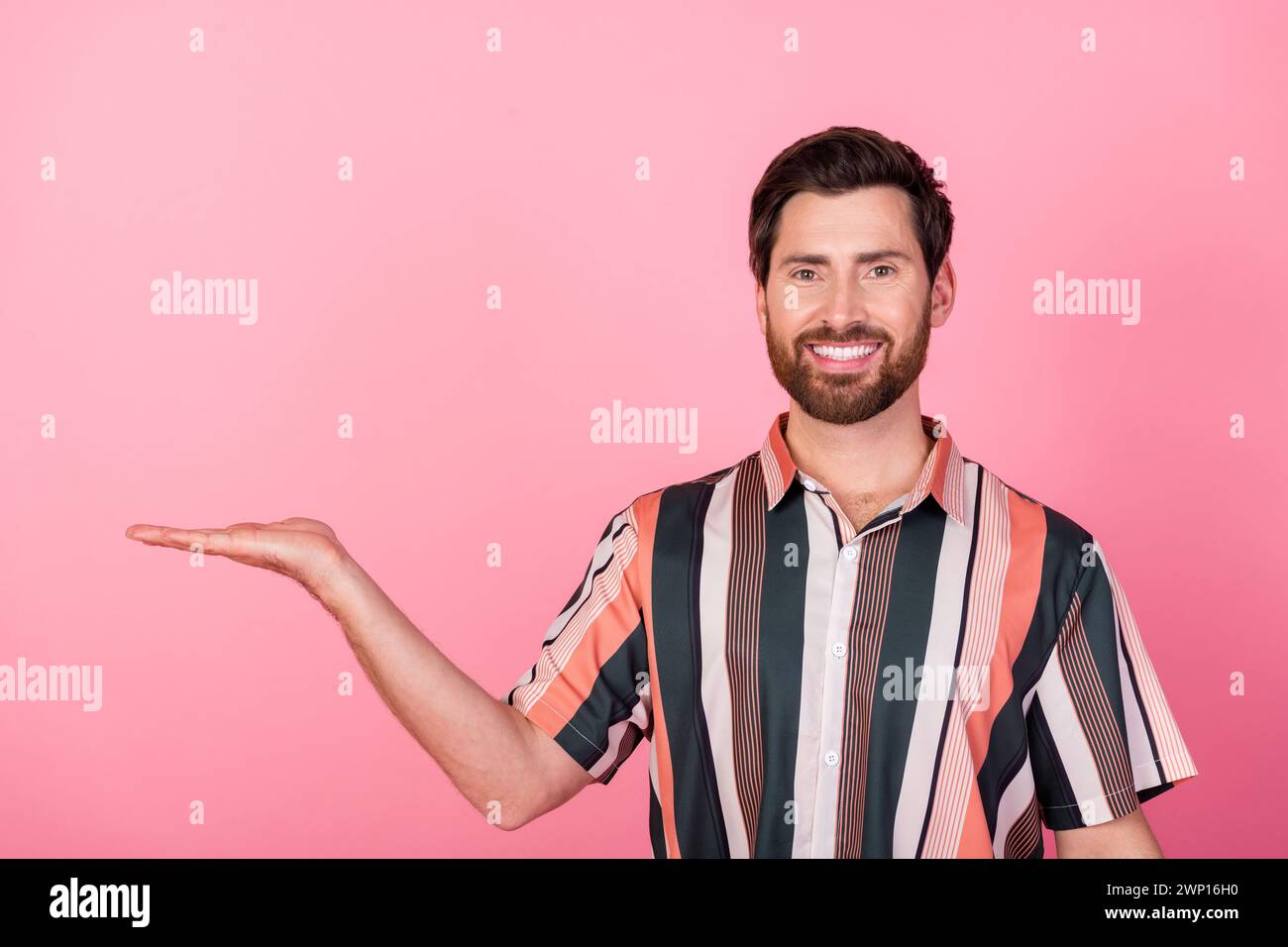 Photo of nice friendly man beaming smile arm palm hold demonstarte ...