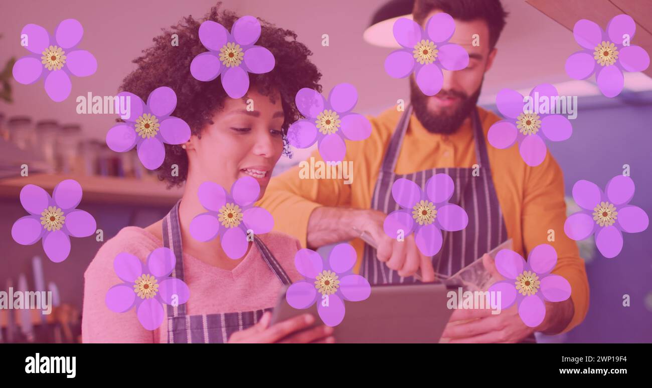 Image of flowers over happy diverse couple cooking together Stock Photo ...