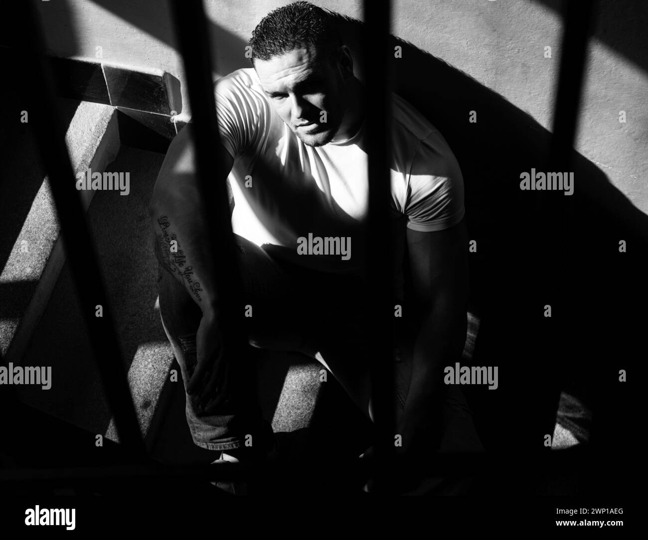 Street fashion man. Male model on stairs Stock Photo - Alamy