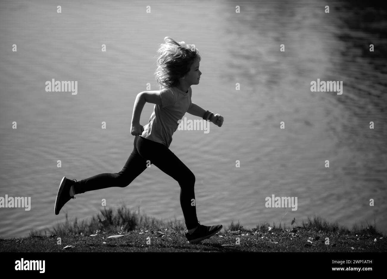Child runners run in park. Boy running in the park in summer in nature ...