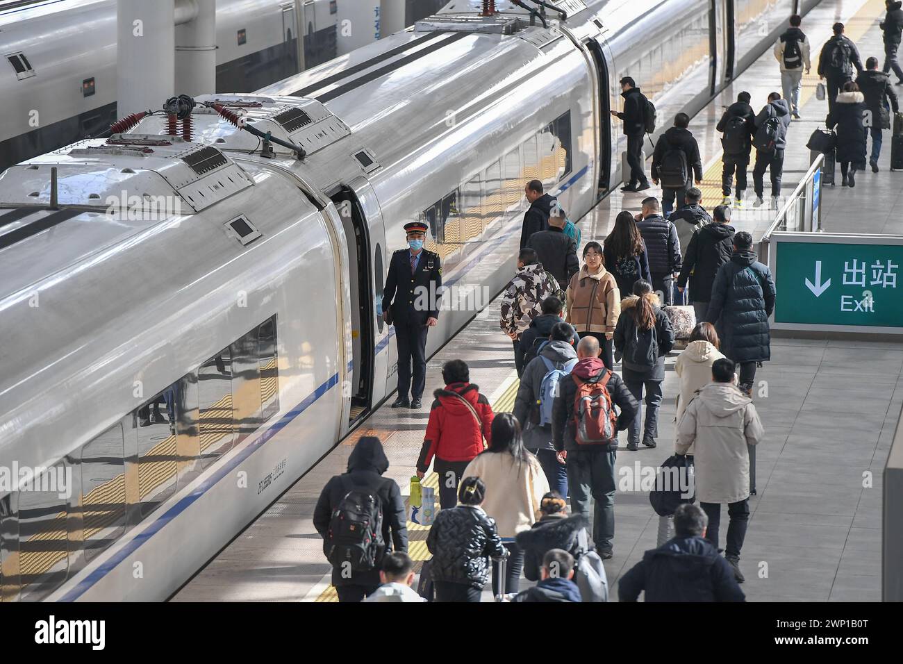 Beijing, China's Jilin Province. 5th Mar, 2024. Passengers board a ...