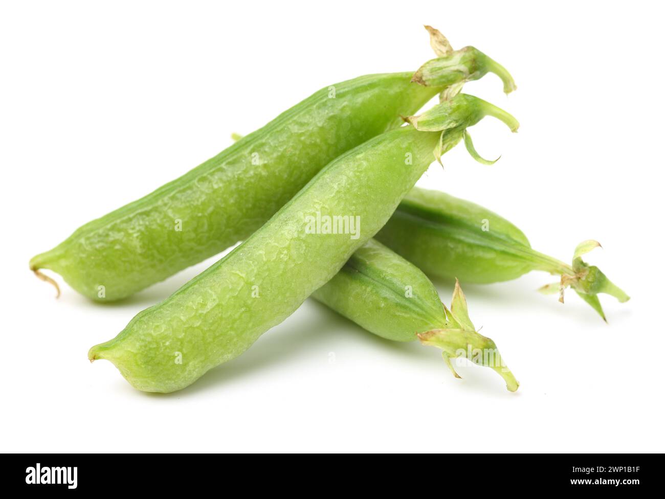 Fresh peas on white background Stock Photo - Alamy