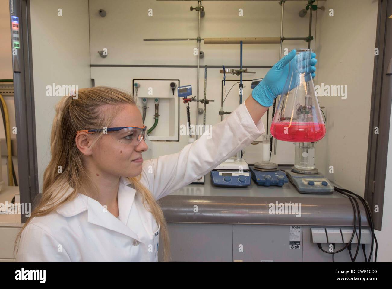 a woman working in a chemical laboratory, research and science woman ...