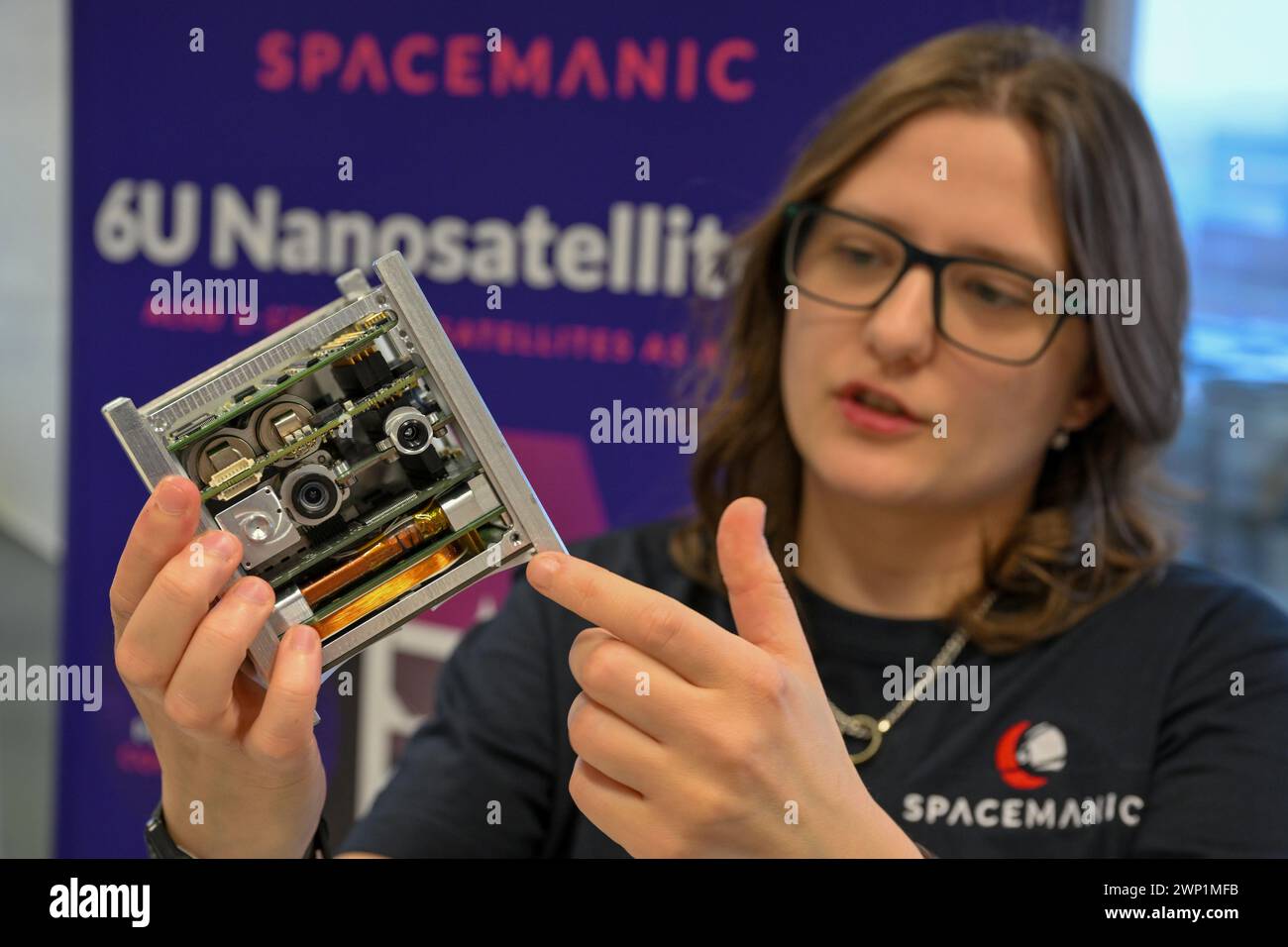 Brno, Czech Republic. 05th Mar, 2024. Natalia Gogolova shows model of satellite at Spacemanic ...