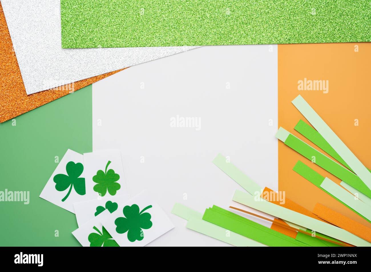 Irish flag made from color paper with cut out shamrock clover and ...