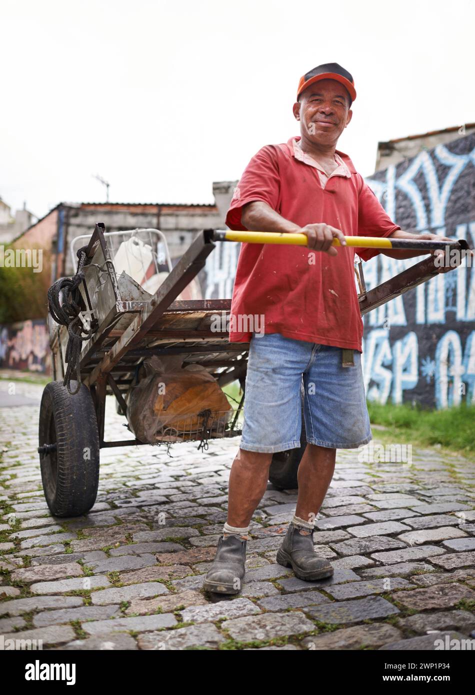 Man, portrait and cart for trash in street for smile, walk and collect ...