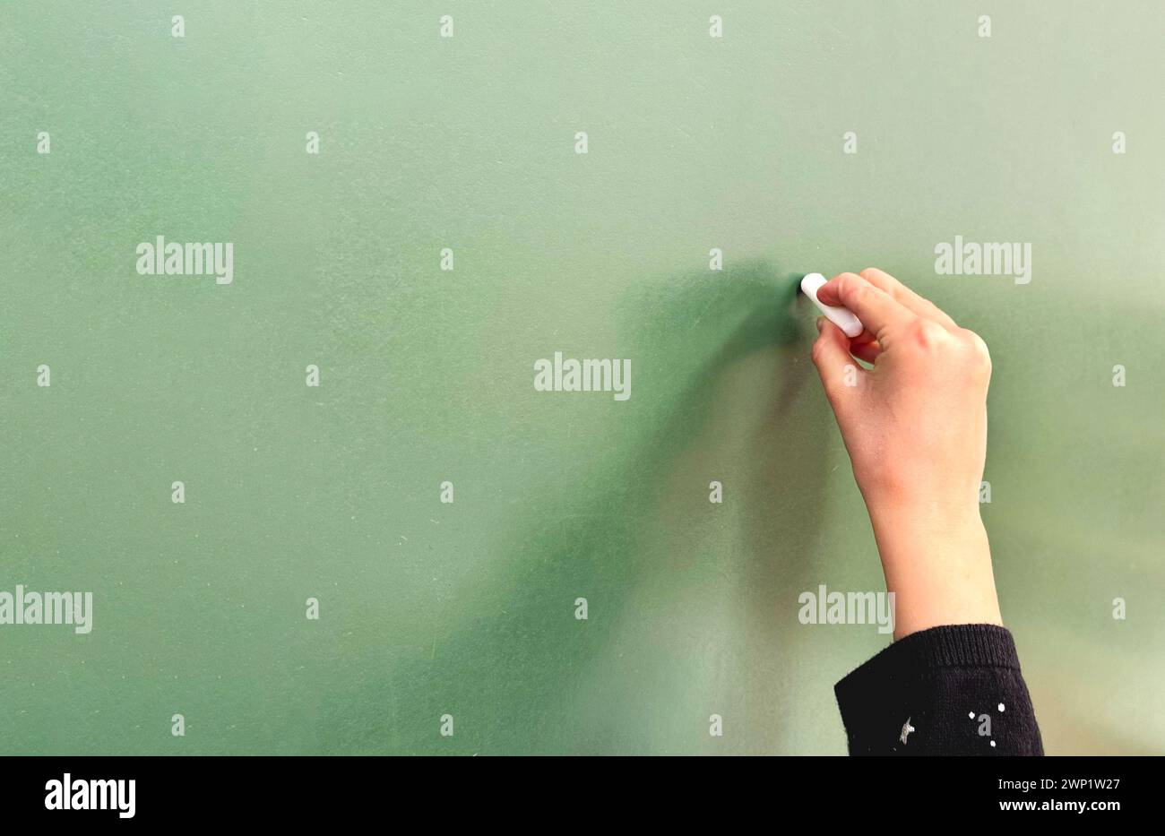 Young girl writing on chalkboard hi-res stock photography and images ...