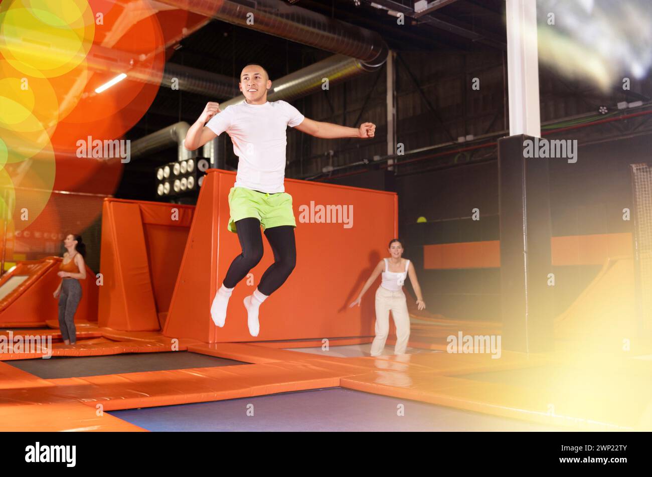 Fitness, fun, leisure and sport activity concept - happy man jumping on ...