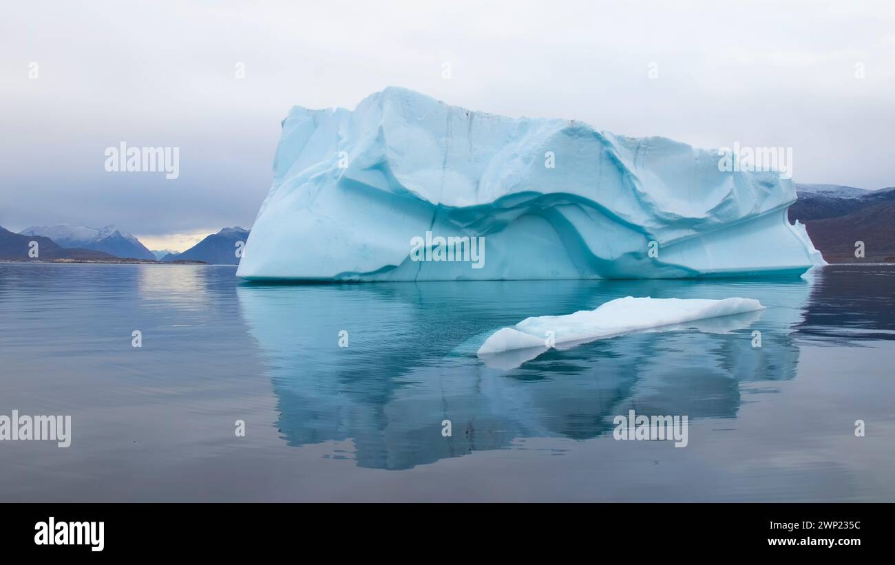 large blue tinged iceberg with creased pattern floats off Nanortalik in ...