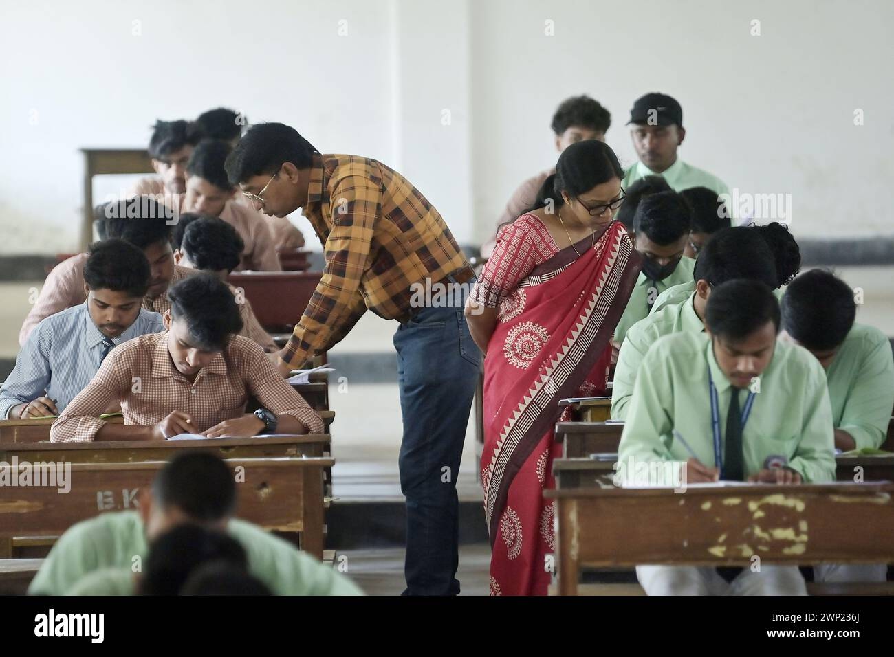 Students are seen writing an English paper. This is the first exam for ...
