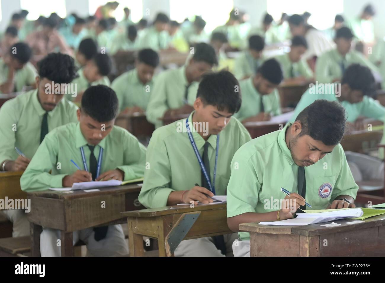 Students are seen writing an English paper. This is the first exam for ...