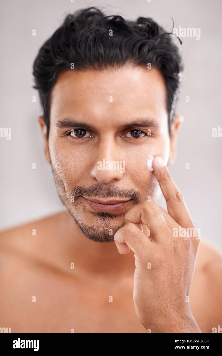 Skincare, portrait and cream with man in bathroom for morning routine ...