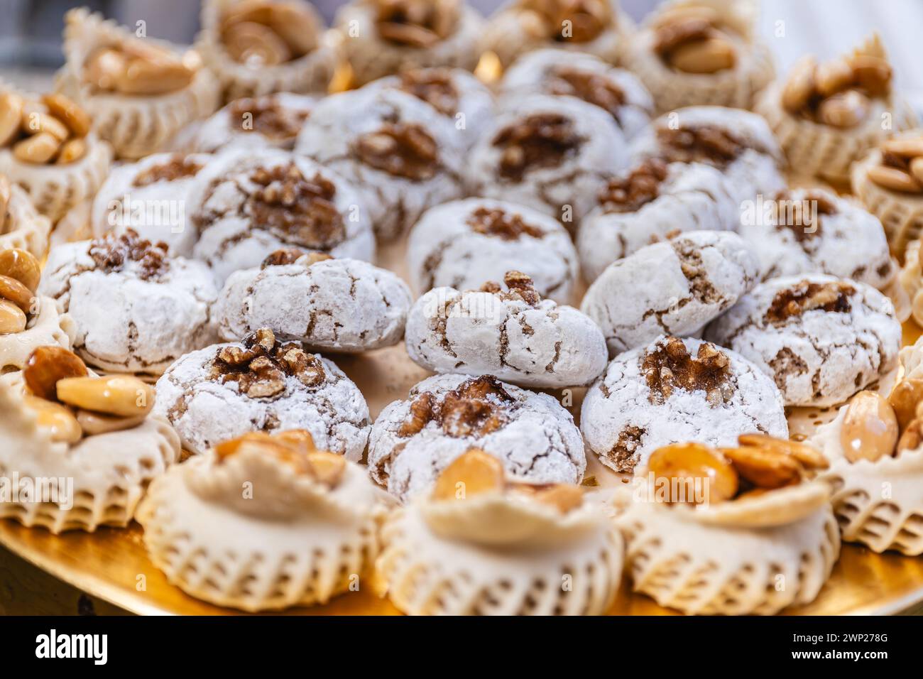 Horizontal photo a vibrant selection of Arabic nut pastries, dusted ...