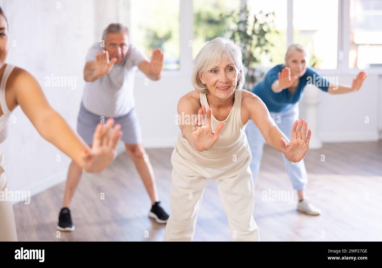 Group of mature people dancing modern dance in studio Stock Photo - Alamy