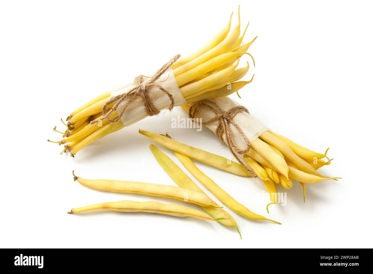 Two bunches and small pile of raw yellow pods of haricot isolated on ...