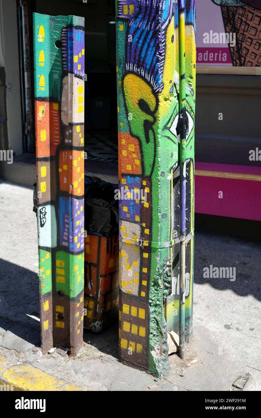 Concrete posts decorated in bright colours Stock Photo - Alamy
