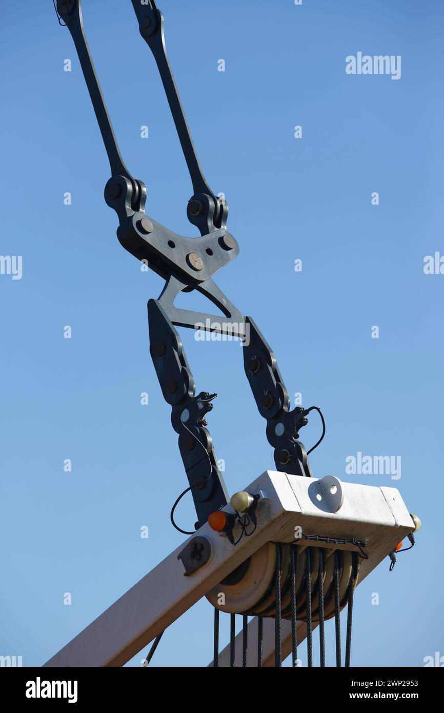 Mobile crane close up of wire ropes and pulley block with steel ...