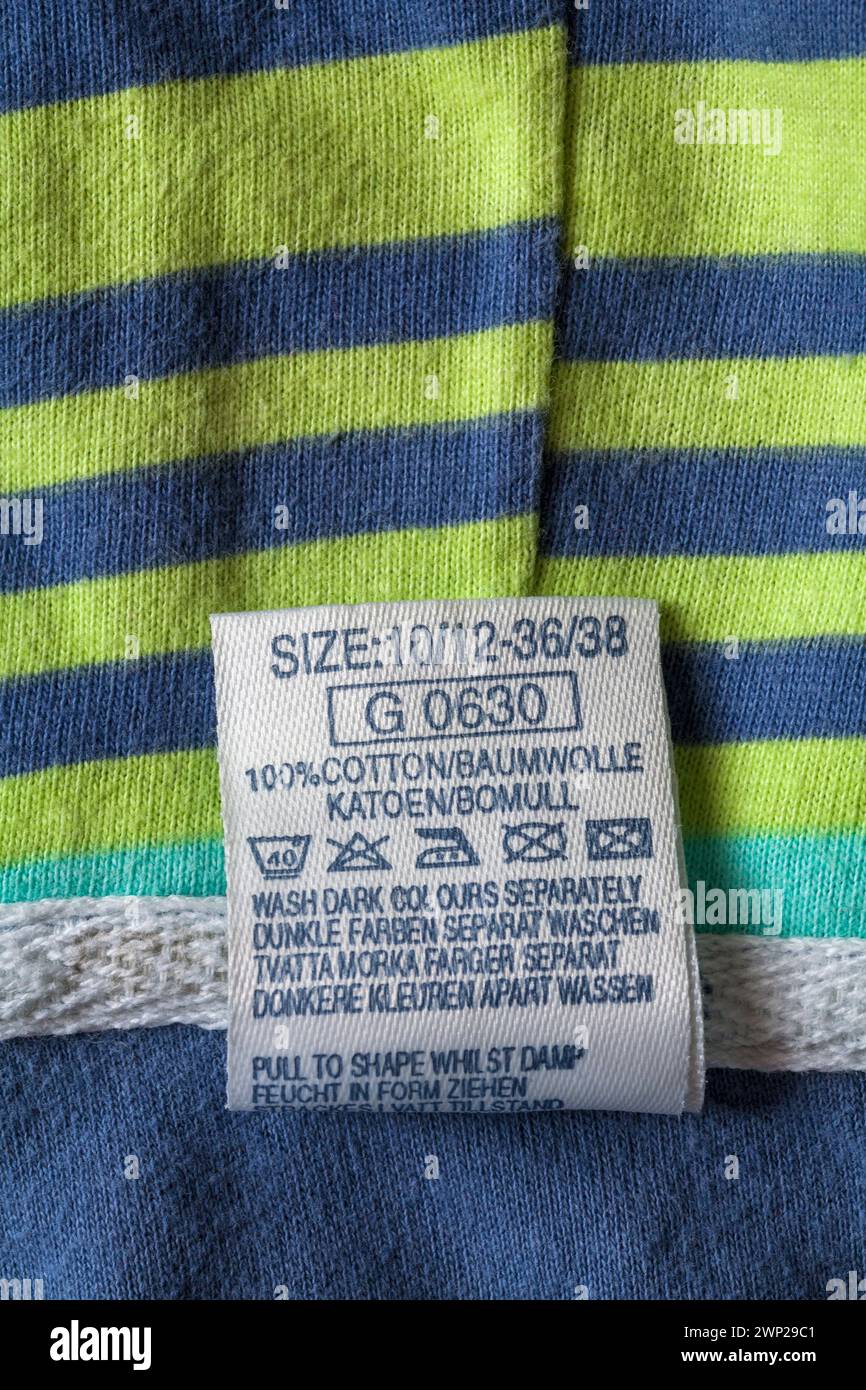 washing care symbols instructions label in 100% cotton hoodie garment ...