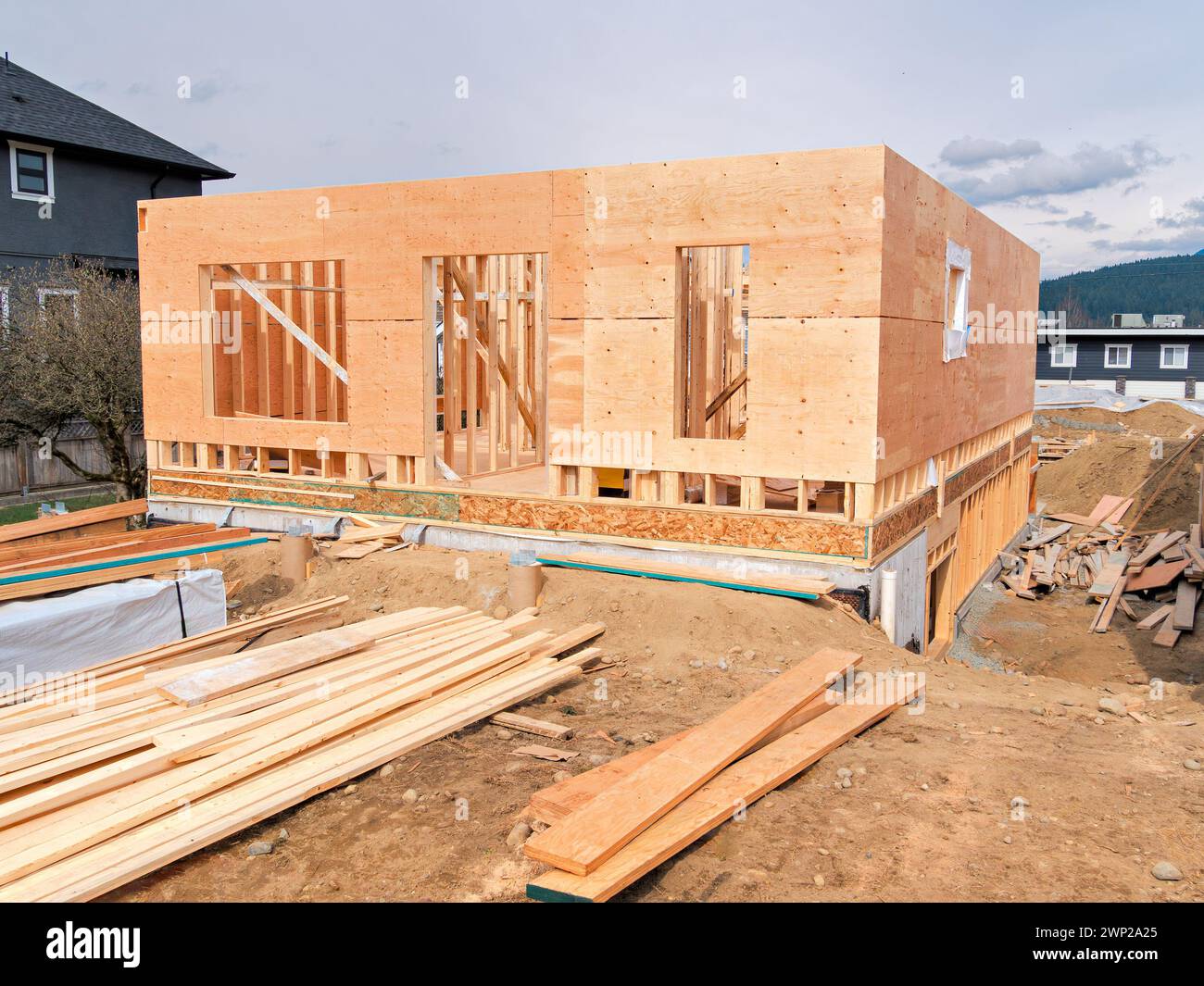 Wooden frame of a new house with engineered lumber materials in front ...