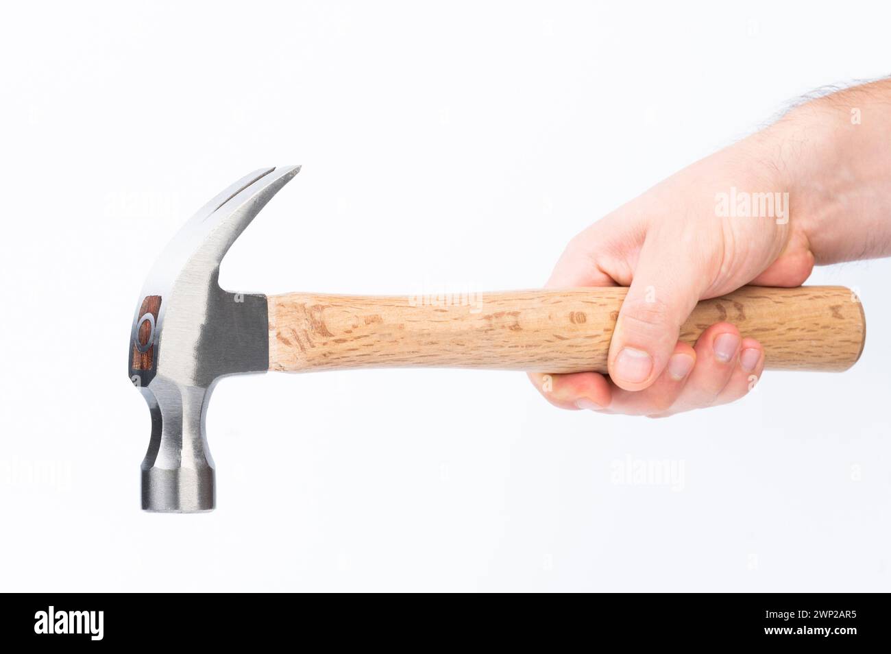 Hand hold hammer with metal head isolated on white studio background ...