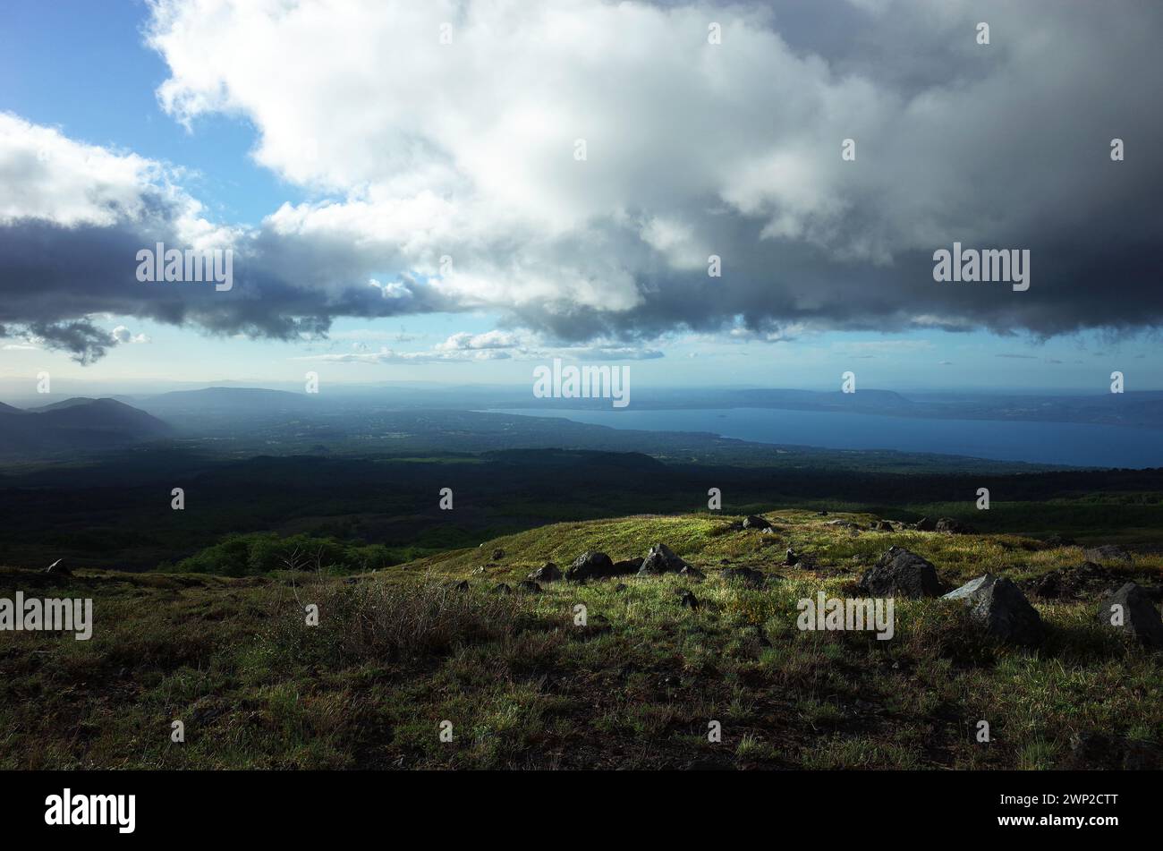 Nature landscape of Chile, Sun is shining on green grass on slope of ...