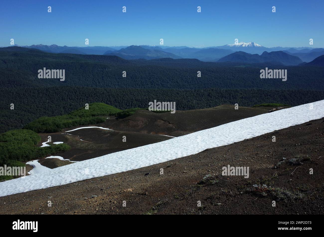Snow line on mountain slope and view of mountain landscape on horizon ...